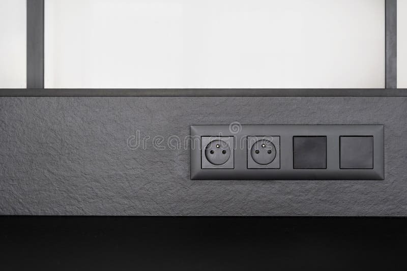 Closeup of Light Switch and Electrical Socket on Textured Wall ...