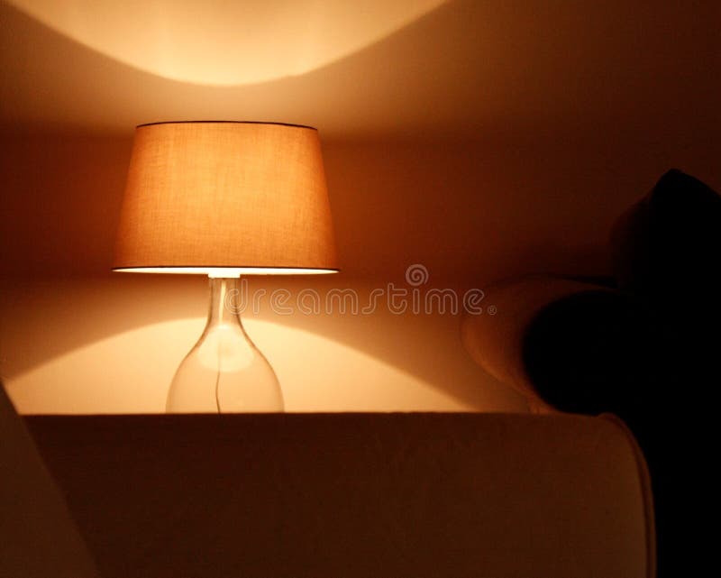 Closeup of a Lighted Lamp Near Brown Wall Stock Image - Image of black ...