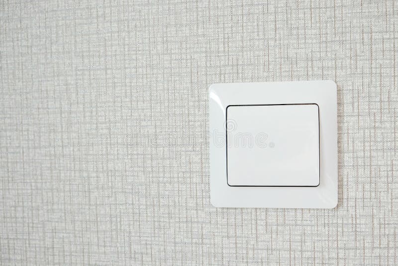 Closeup of a Lighting Switch on Concrete Wallpaper Background with Copy ...