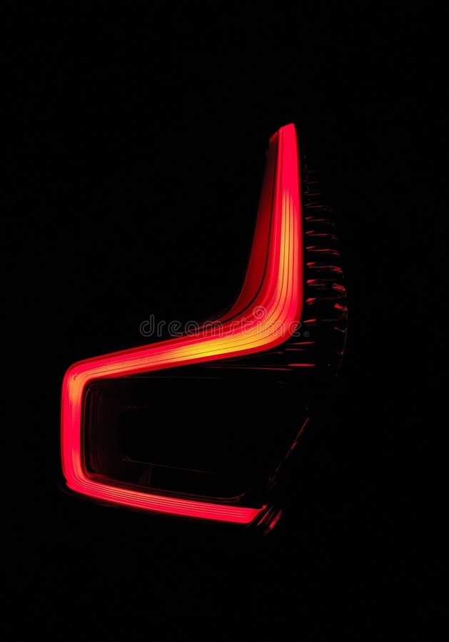 Closeup of a Lit Red Tail Light of a Car Against a Dark Background ...