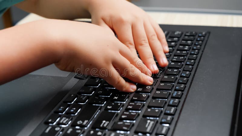 Closeup of Little Boy Typing and Pressing Buttons on Laptop Keyboard ...