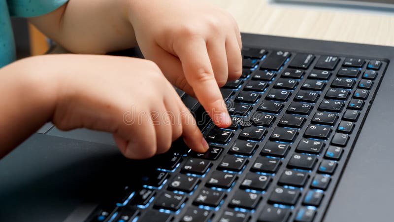 Closeup of Little Child Fingers Pressing Buttons on Laptop Keyboard ...