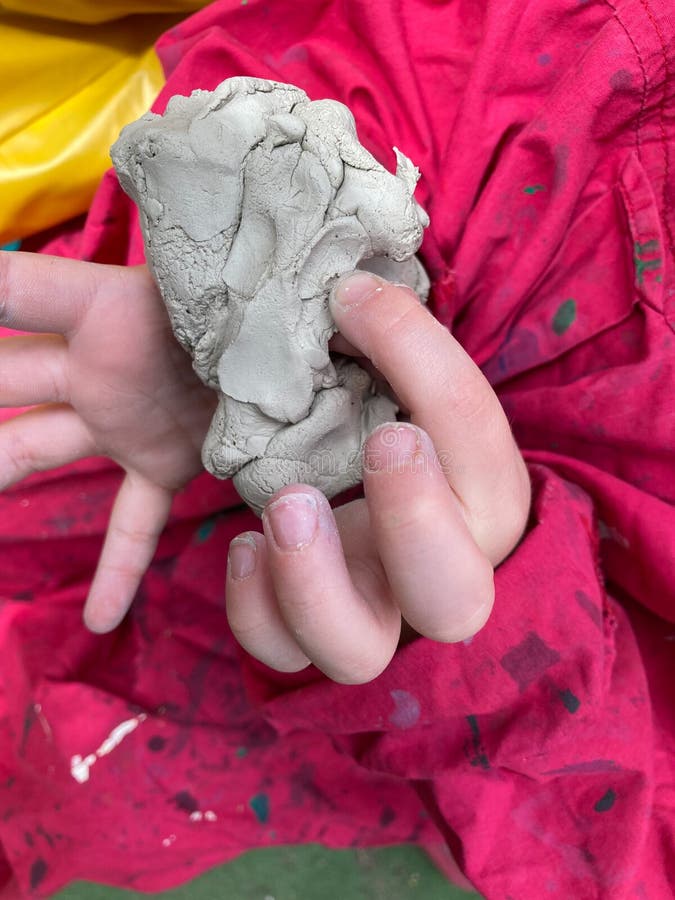 Closeup of Little Child`s Hands Working with Clay, Play Dough, on a ...