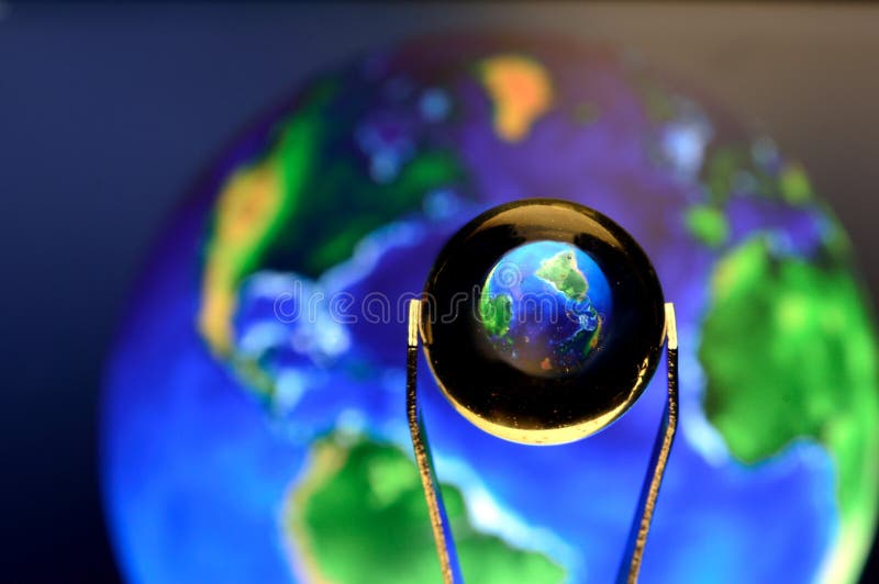 Closeup of a Little Glass Ball Reflecting the Planet Earth Stock Photo ...