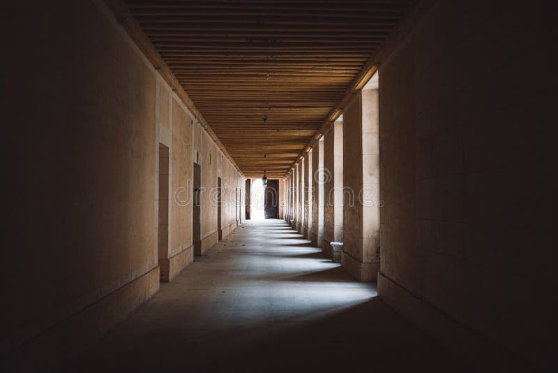 Closeup of a Long Hallway with Lights between Columns Stock Image ...