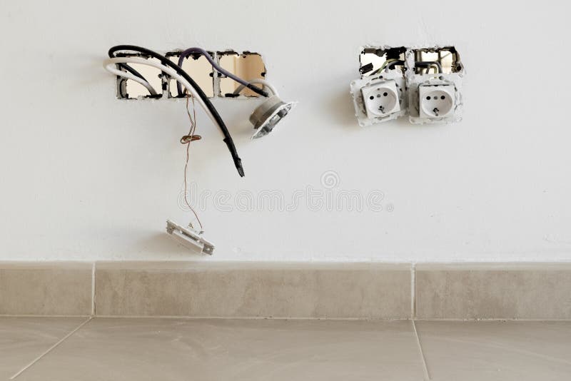 Installing Electrical Sockets on a Wall Stock Photo - Image of ...
