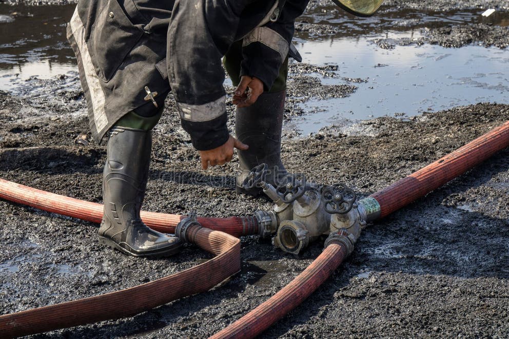 Closeup of Male Firefighter Hands Rolling Hose Stock Photo - Image of ...
