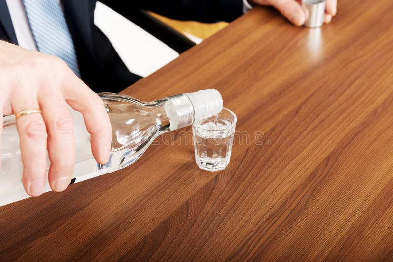 Closeup on Male Hand Pouring Vodka into a Glass Stock Photo - Image of ...