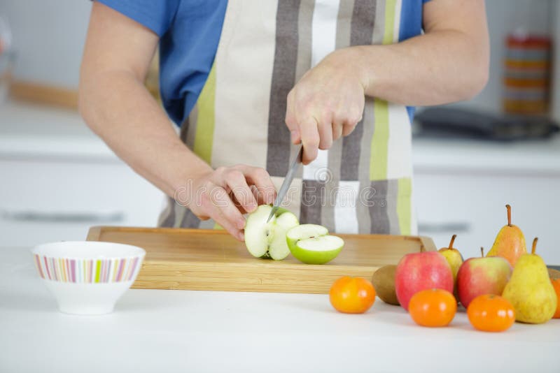 Closeup man chopping fruit stock photo. Image of edible - 93766114