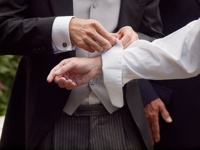 Closeup of a Man Correcting a Sleeve Stock Image - Image of black ...