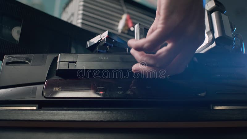 Closeup of Man Ejecting VHS Tape from Player Stock Video - Video of ...