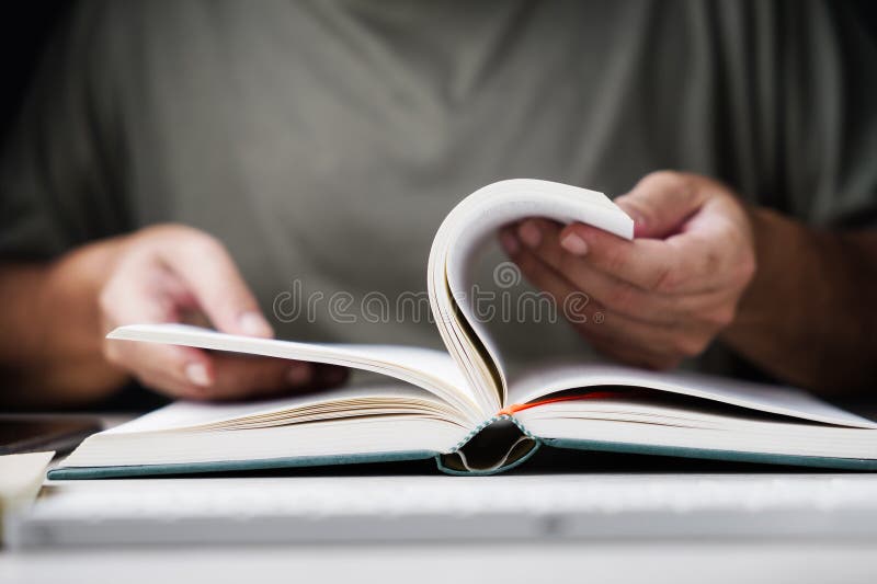 Closeup Man Flips the Book Pages To Search the Information Stock Image ...