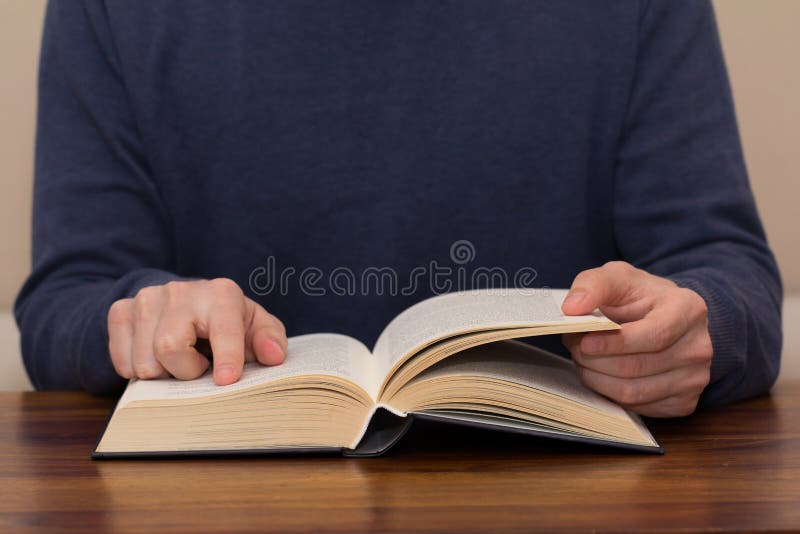 Closeup of Man Hands Reading Book Stock Image - Image of table ...