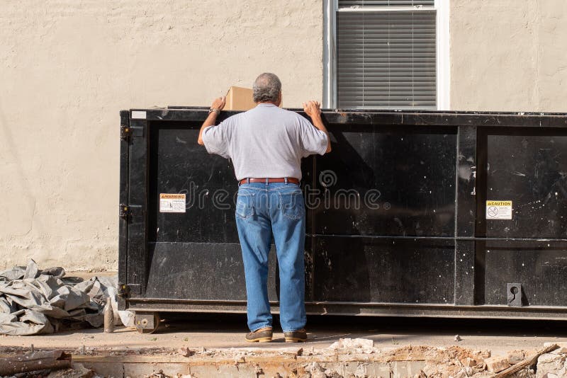 Closeup of a Man Looking Inside of Big Trash Cans on the Streets Stock ...