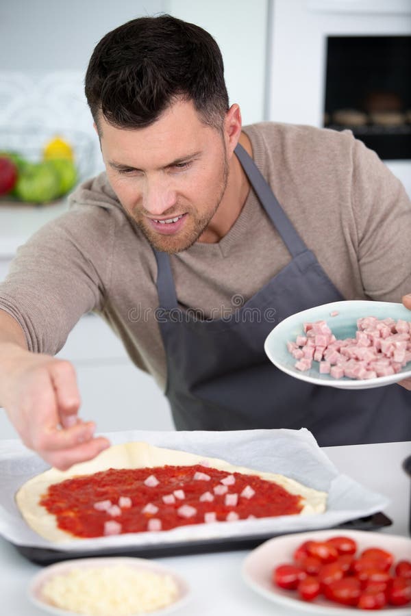 Closeup man making pizza stock image. Image of cook - 278504863