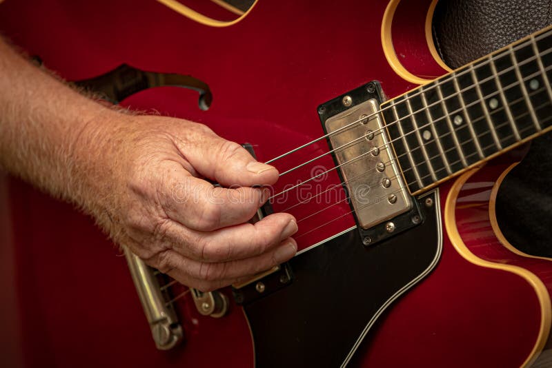Base Guitar Leaning Against a Wall with a Tambourine Stock Image ...