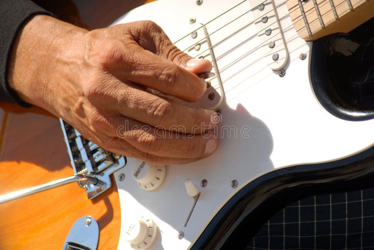 A Closeup of a Man Playing a Guitar Stock Photo - Image of fingers ...