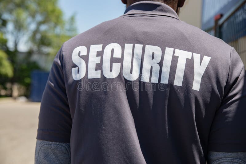 Closeup of a Man S Back in Uniform with "Security" Writing Stock Photo ...