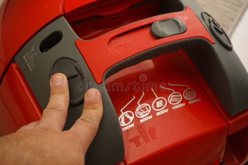 Closeup Of Man S Fingers Pushing Black And White Vacuum Cleaner S Power Button Stock Image