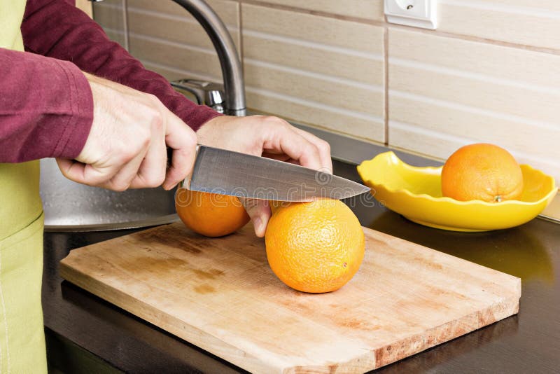 Cutting oranges stock image. Image of fruit, hand, studio - 13839887