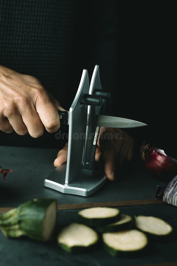 Closeup of a Man Sharpening a Kitchen Knife Stock Image - Image of ...