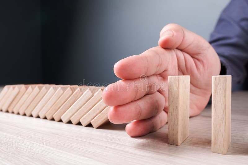 Stop the domino effect stock image. Image of domino - 249015179