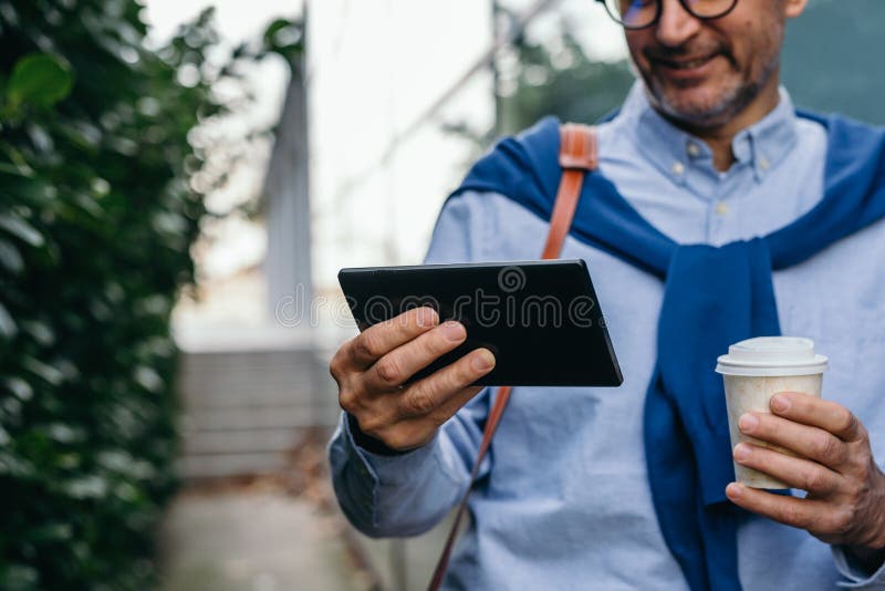 Closeup Man Using Tablet Outdoor in the City Stock Photo - Image of ...