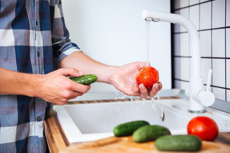 Closeup of Man Washing Tomatoes and Cucumbers on the Kitchen Stock ...