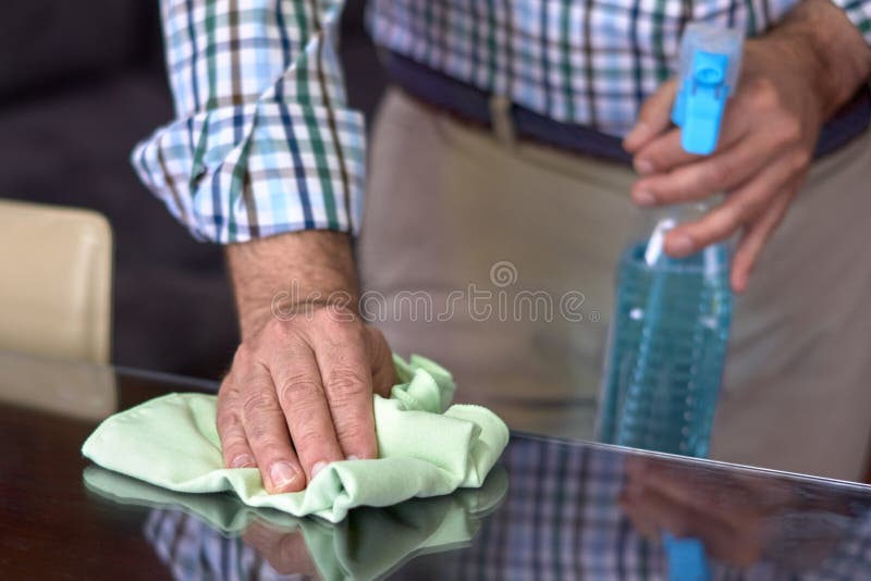 Closeup of a Man Wiping a Glass Surface with a Cloth Stock Photo ...