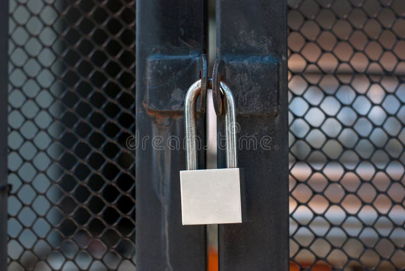 Closeup, Master Key Silver Lock on the Black Iron Door. Stock Photo ...