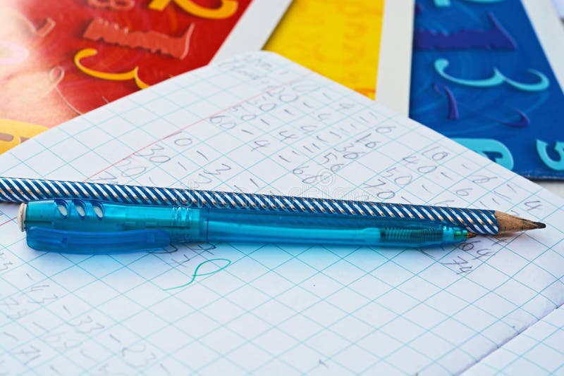 Closeup Math Exercises Written in a Textbook with a Pen and Pencil on ...