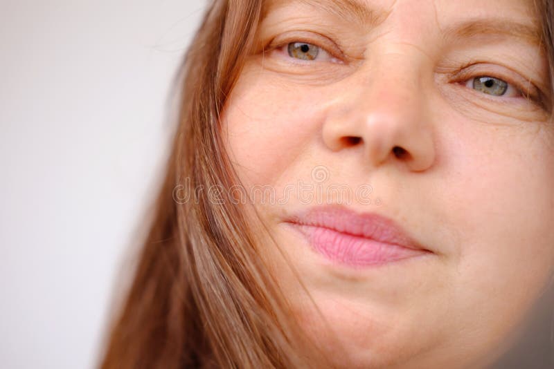 Closeup Of Mature Female Face Woman 50 Years Old Slight Smile On The Lips Small Wrinkles