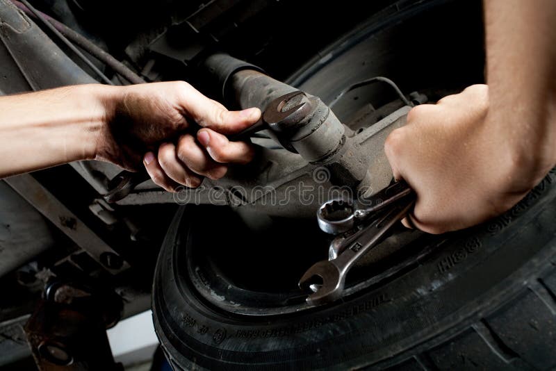Closeup of Mechanics Hands Working Below Car Stock Image - Image of ...