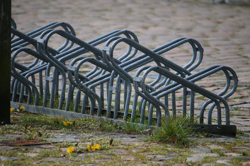 A Closeup of a Metal Bike Rack on Cobblestones Stock Image - Image of ...