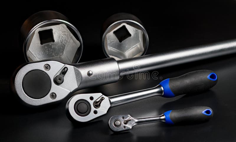 Closeup of Metal Ratchets and Interchangeable Hex Sockets on Black ...
