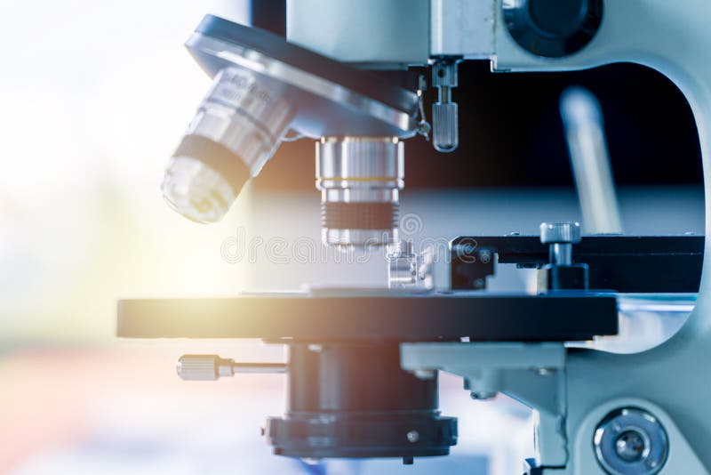 Closeup Microscope Lens on Gray Background in Laboratory Stock Photo ...