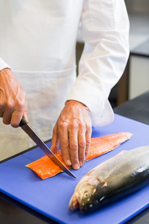 Closeup Mid Section of a Chef Cutting Fish Stock Photo - Image of food ...