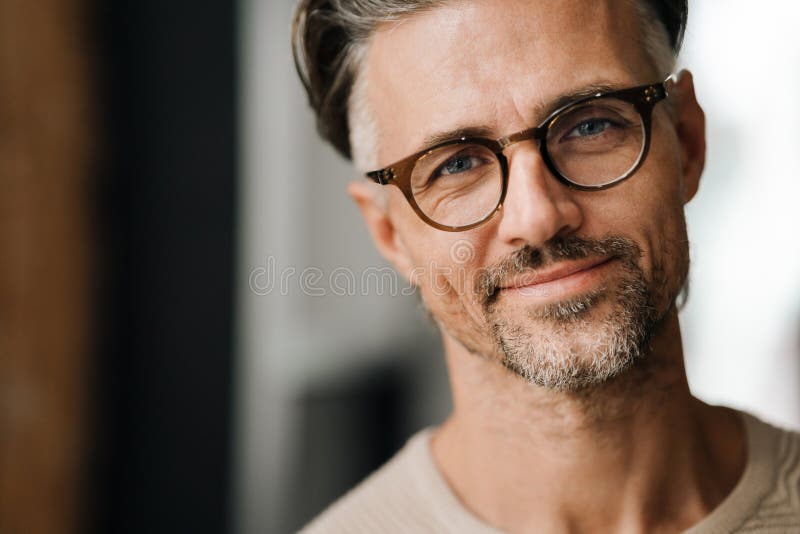 Closeup of Middle-aged Man Smiling at Camera while Standing Indoors ...