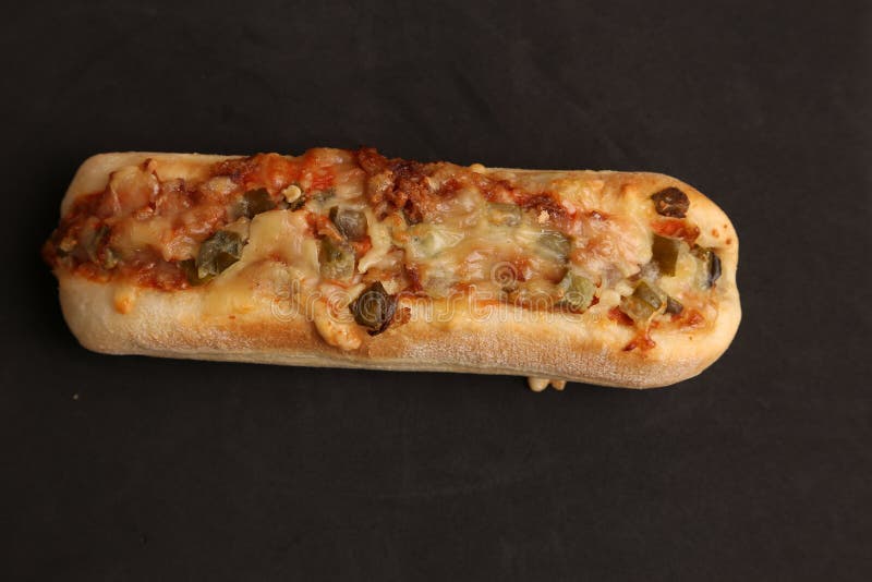 Closeup of Mini Pizza with Cheese and Vegetables on a Black Background ...