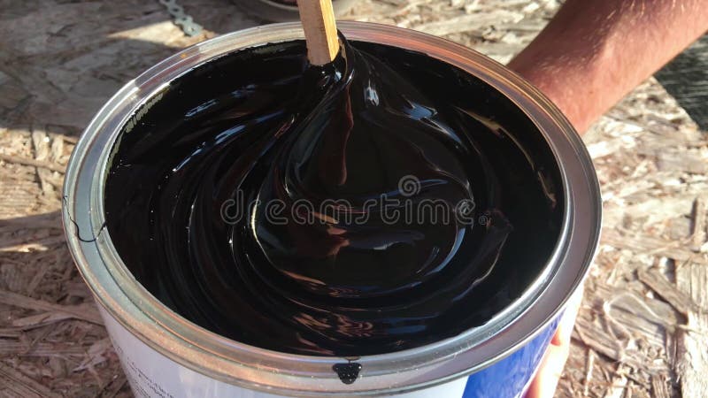 Closeup of the Mixing Process of Thick Black Waterproofing Building ...