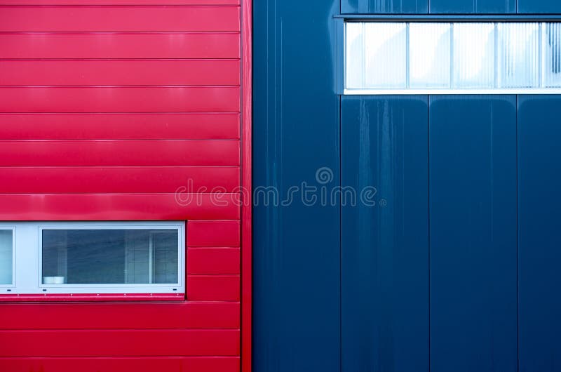 Closeup of a Modern Building with Red and Blue Walls Under the Lights ...