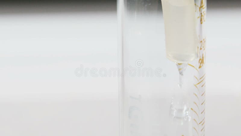 Closeup Motion To Lab Tube Filled with Clear Liquid Drops Stock Video ...