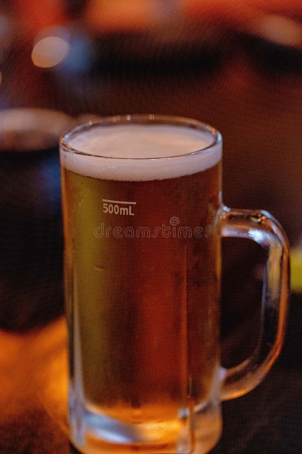 Closeup of a Mug of Cold Beer at Bar Stock Image - Image of liquid ...