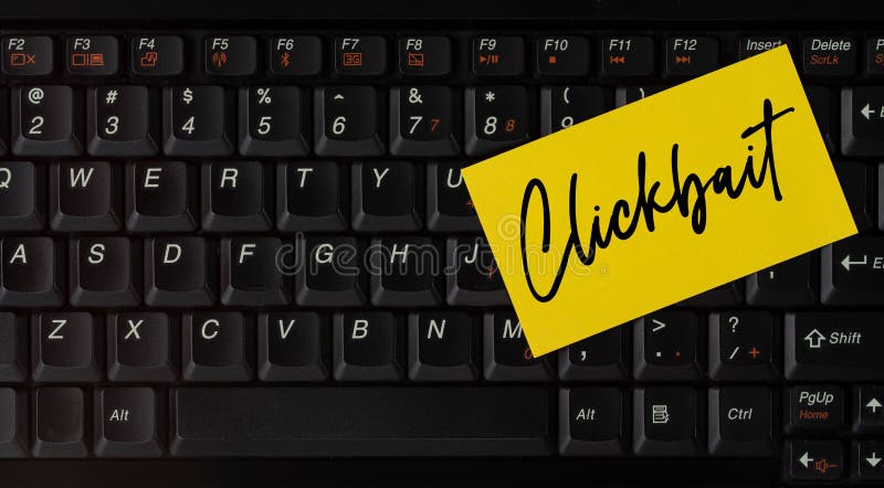Closeup of a Note Reading CLICKBAIT on a Keyboard Portraying the ...