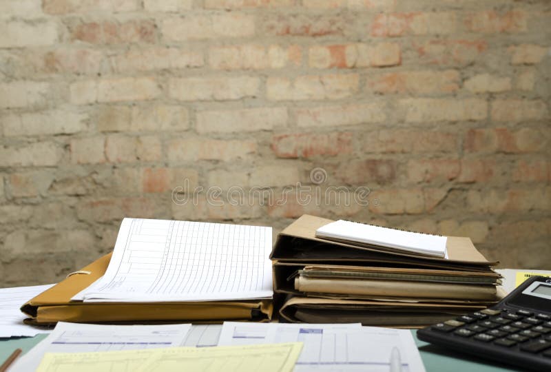 Closeup of Office Table and Stacks of Folders, Documents on it Against ...