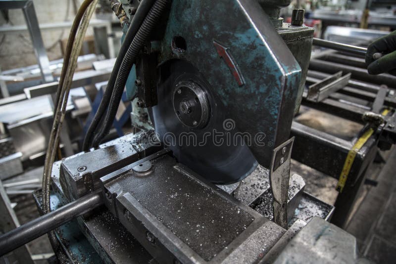 Closeup of an Old Metal Cutting Machine in a Factory Under the Lights ...