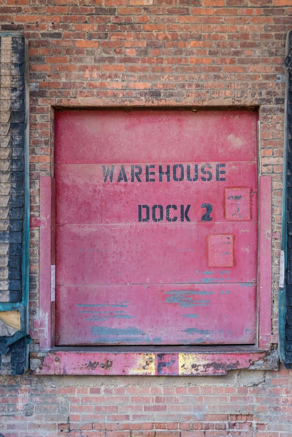 Closeup of Old Red Warehouse Dock Door on Brick Wall Stock Image ...
