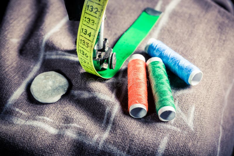 Old Sewing Machine with Needle, Tailor Tape and Threads Stock Image ...