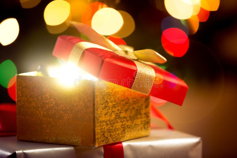 Closeup of Open Christmas Gift Box on Glowing Lights Background Stock ...