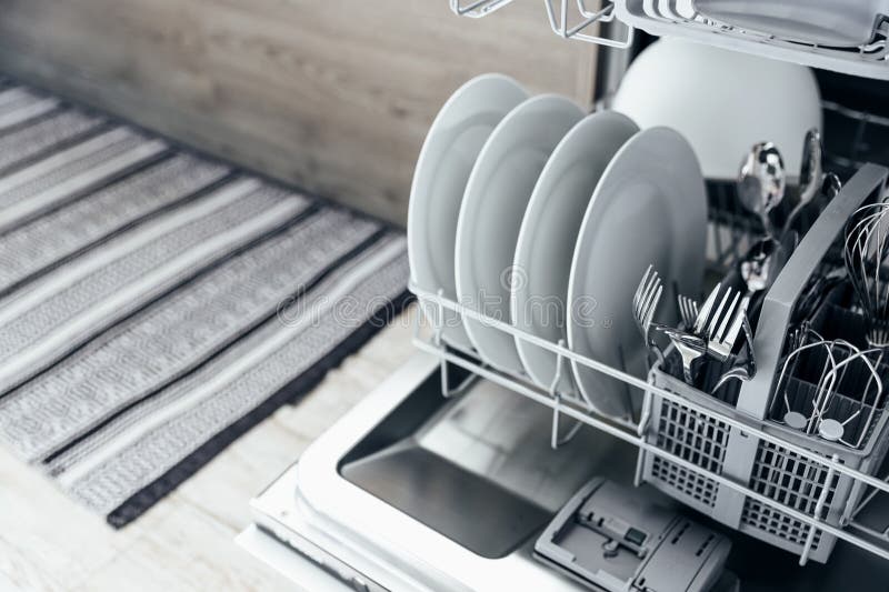 Opened Dishwasher Machine at Kitchen with Clean Utensil, White Plates ...